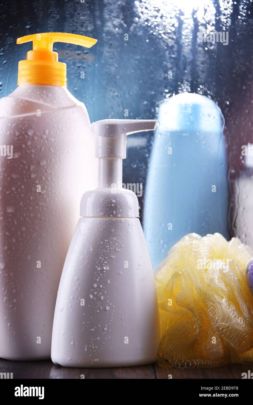 Different containers of body care products in the bathroom Stock Photo ...