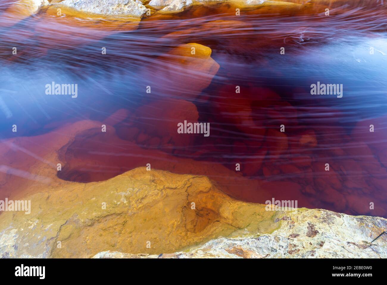 An abstract view of a riverbed in an abandoned mining area with mineral ...