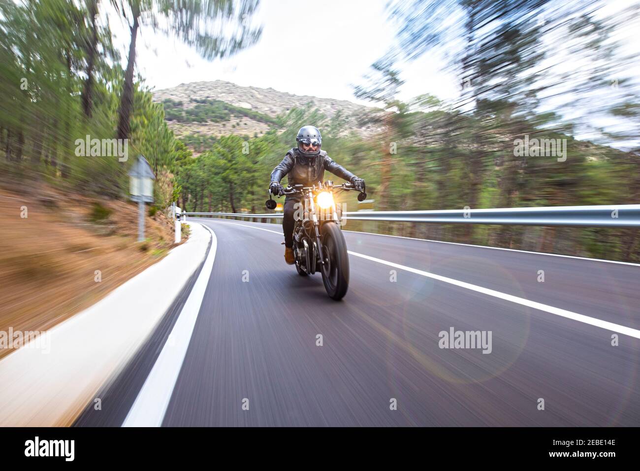 Custom motorcycle driving on the road at high speed Stock Photo - Alamy