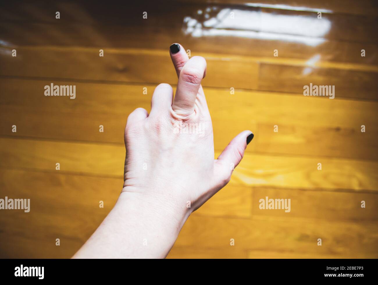 Wrist crossing arm hi-res stock photography and images - Alamy