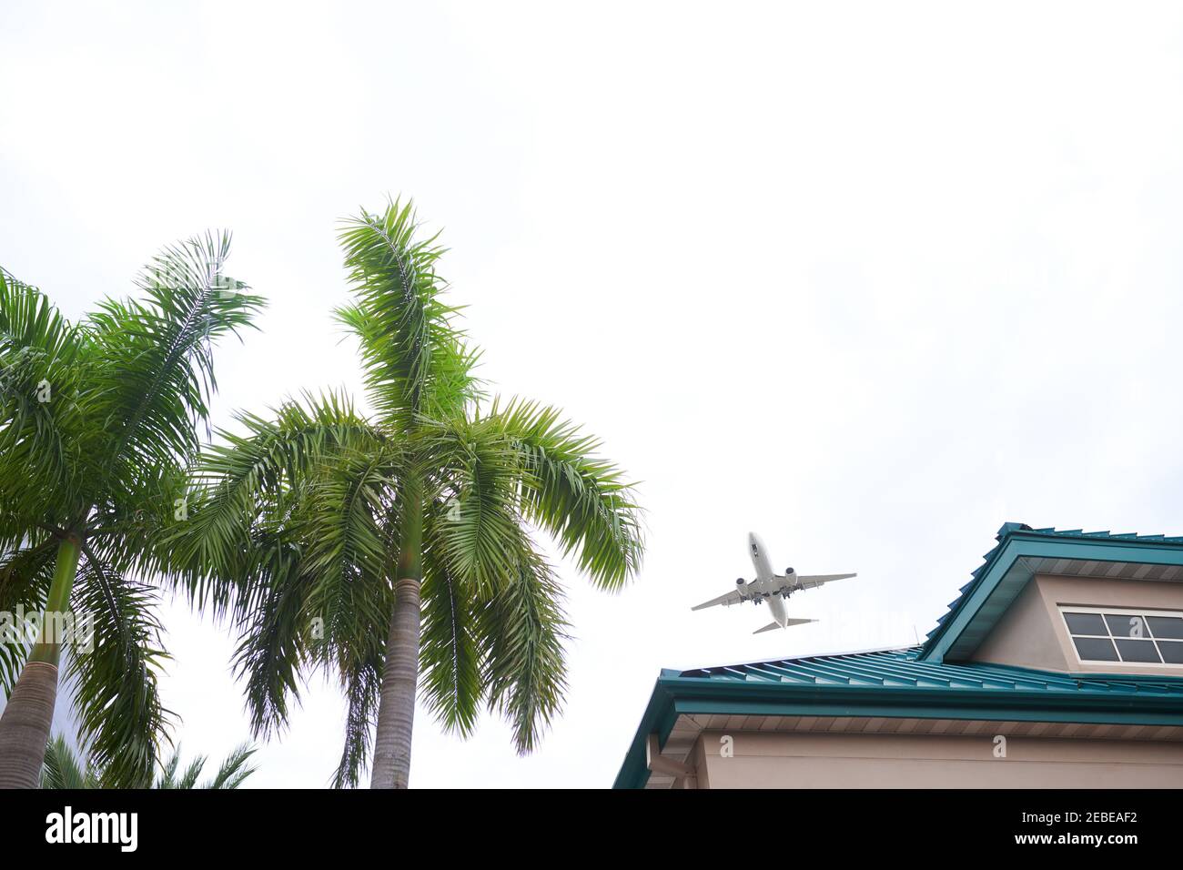 Aircraft over house roof hi-res stock photography and images - Alamy