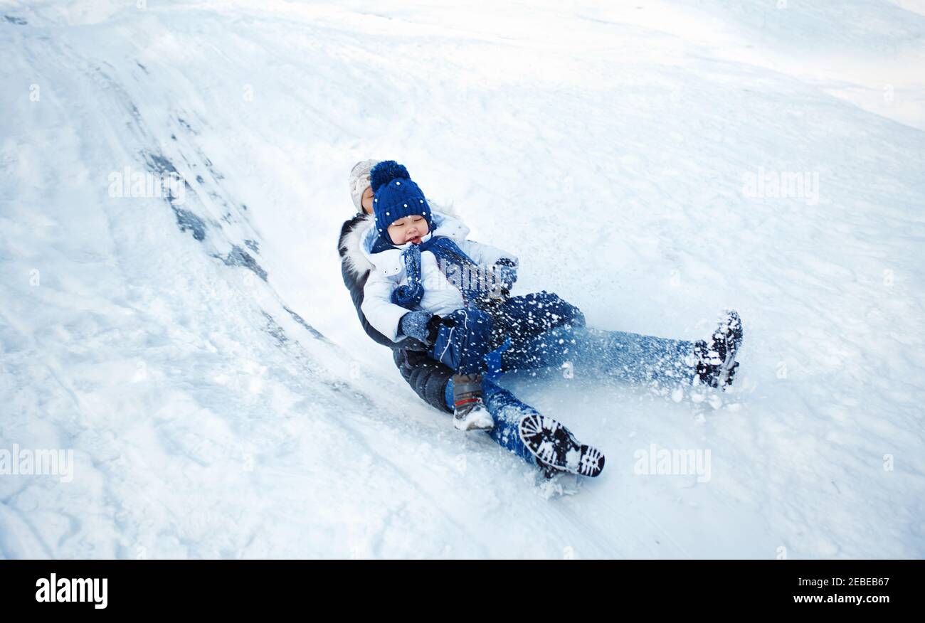 Family riding sledge hi-res stock photography and images - Alamy