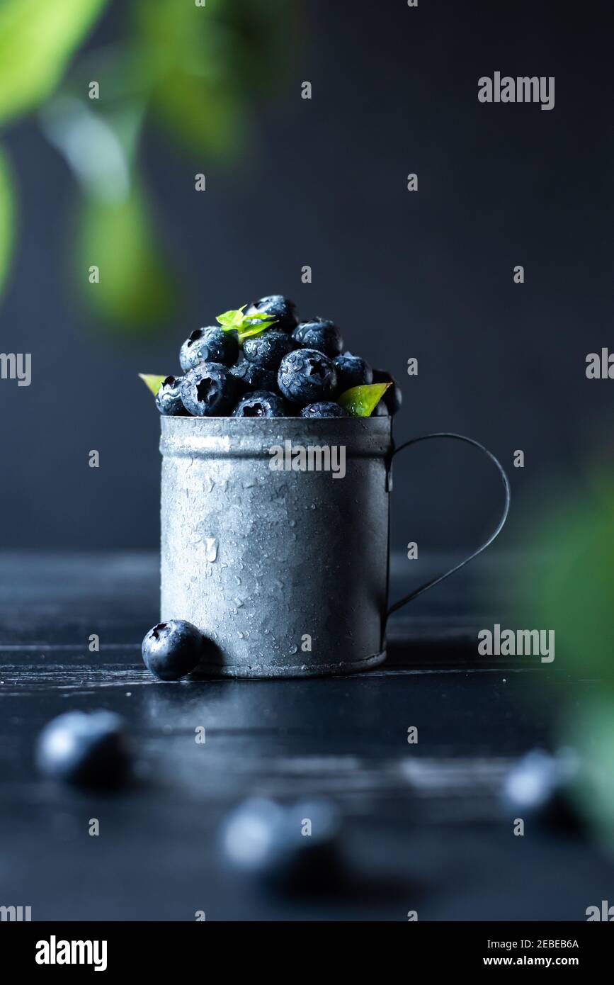 closeup blueberries in vintage metalic cup Stock Photo - Alamy
