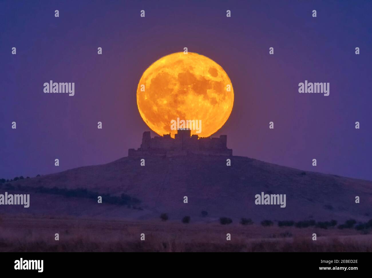 Night view of ancient castle on a mountain with full moon, Spain Stock ...