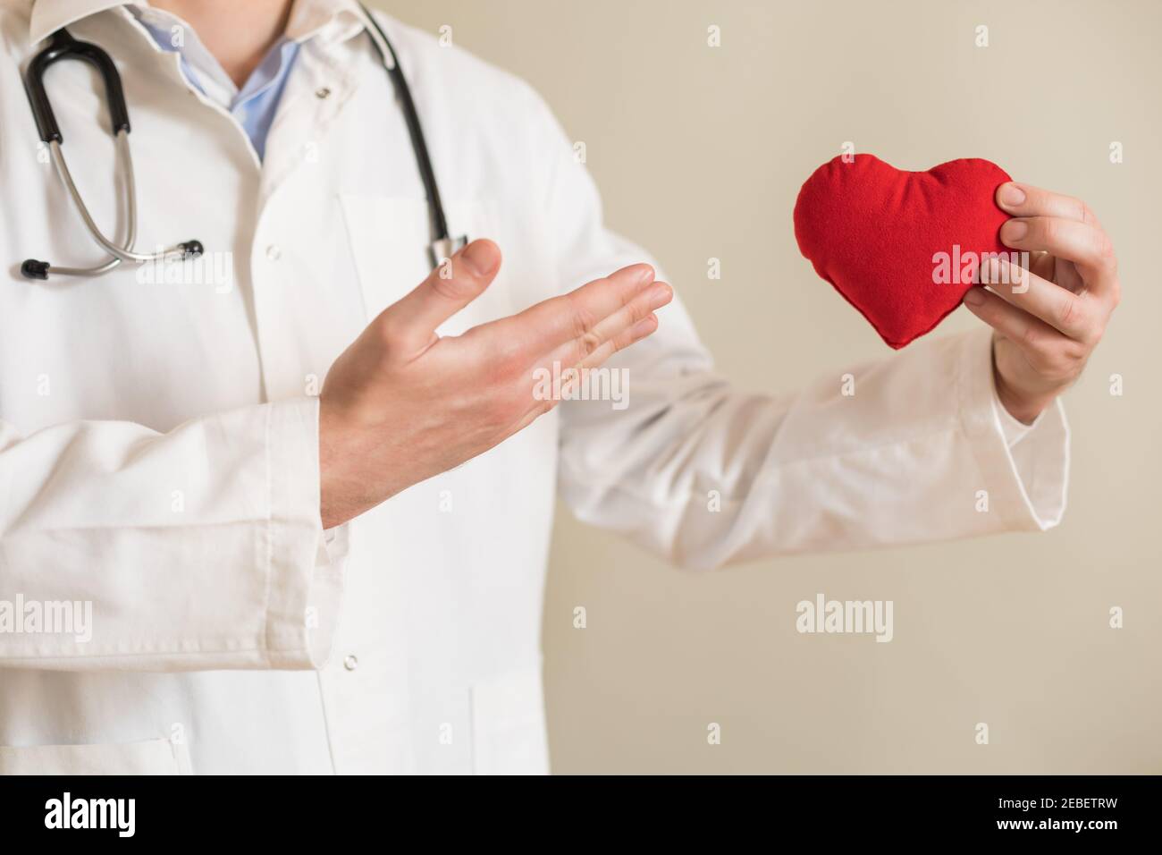 Male cardiologist examining heart hi-res stock photography and images ...