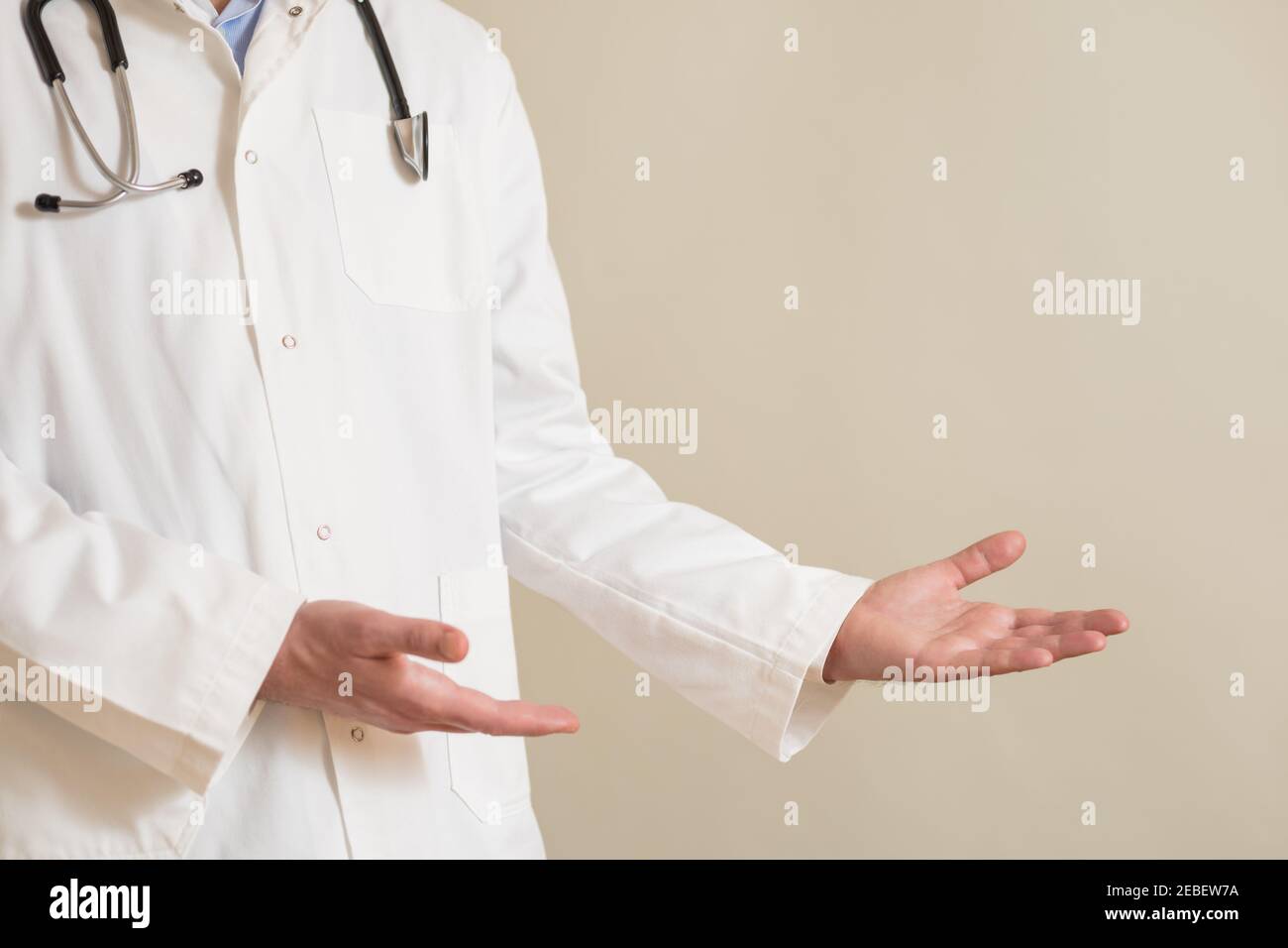 Image of male doctor showing showing welcome gesture Stock Photo - Alamy