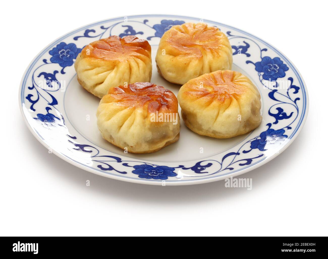 homemade shui jian bao, taiwanese pan fried pork buns isolated on white ...
