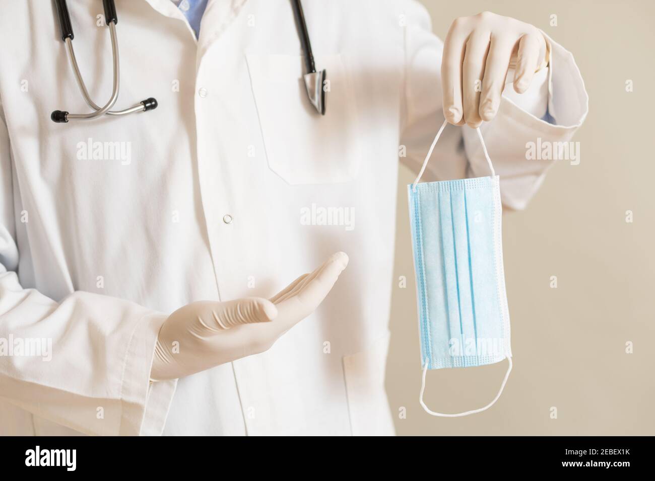 Image of male doctor showing surgical mask Stock Photo - Alamy