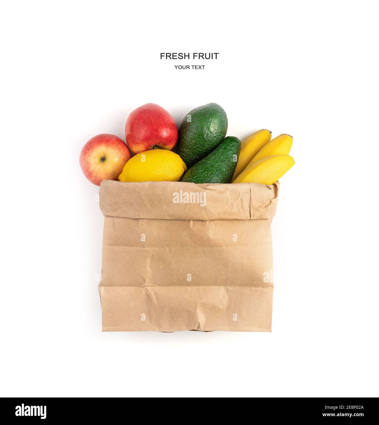 Fresh, juicy fruits are placed in a paper bag on a white background ...