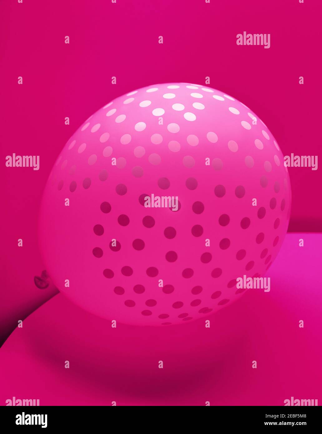 spotty pink balloon Stock Photo - Alamy
