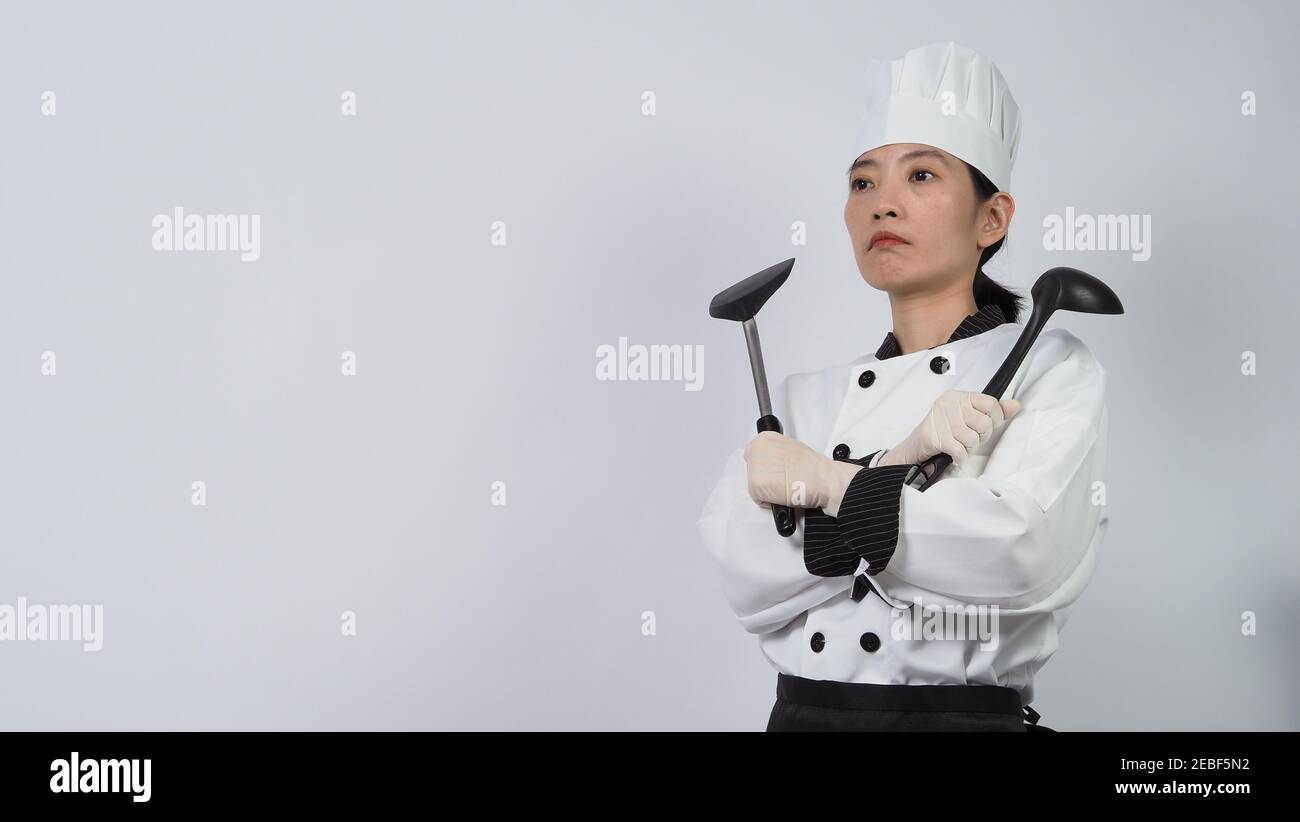 Chef gesturing. Portrait beautiful asian woman cook wearing hat and ...