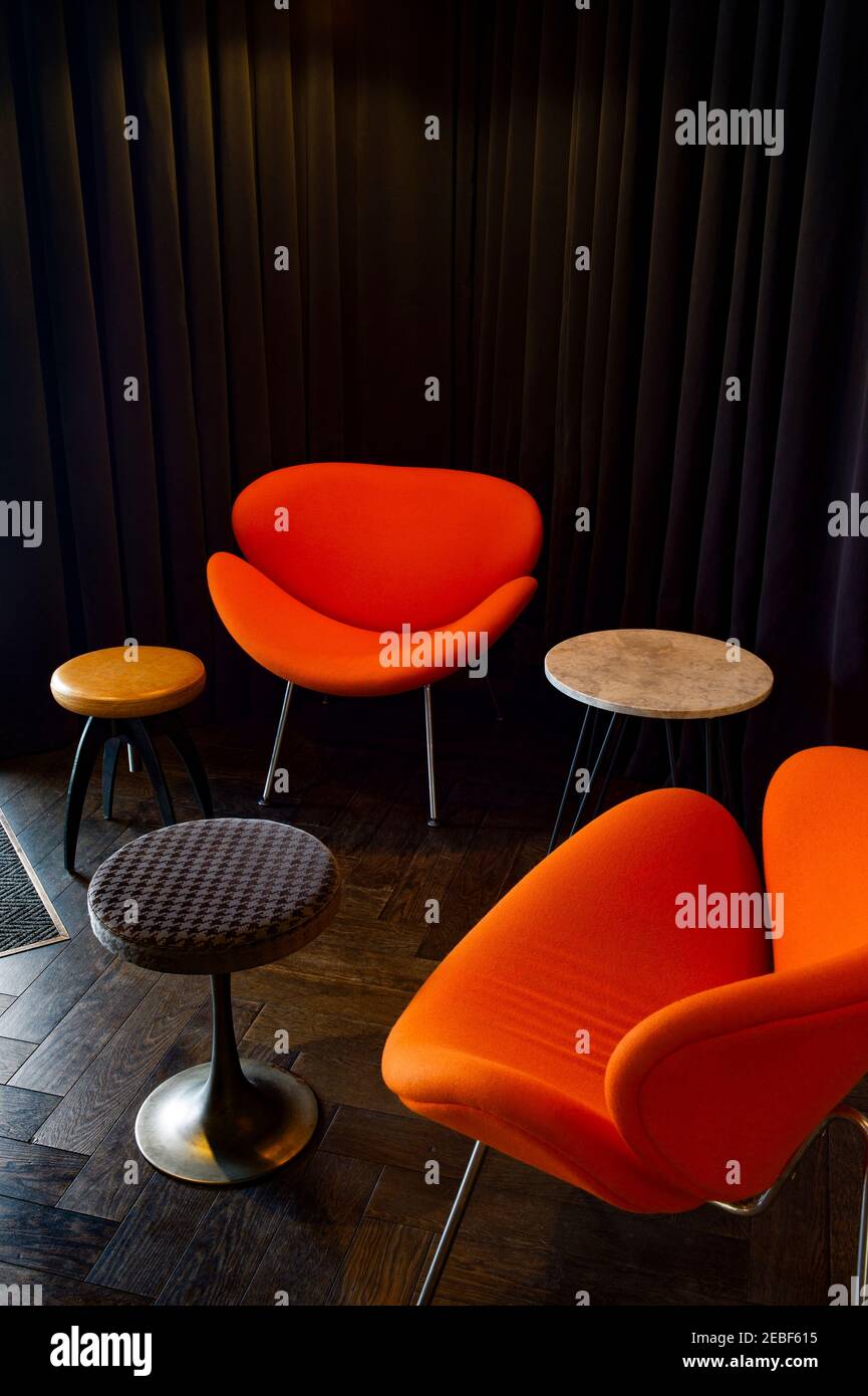 chairs and stools in a waiting room Stock Photo - Alamy