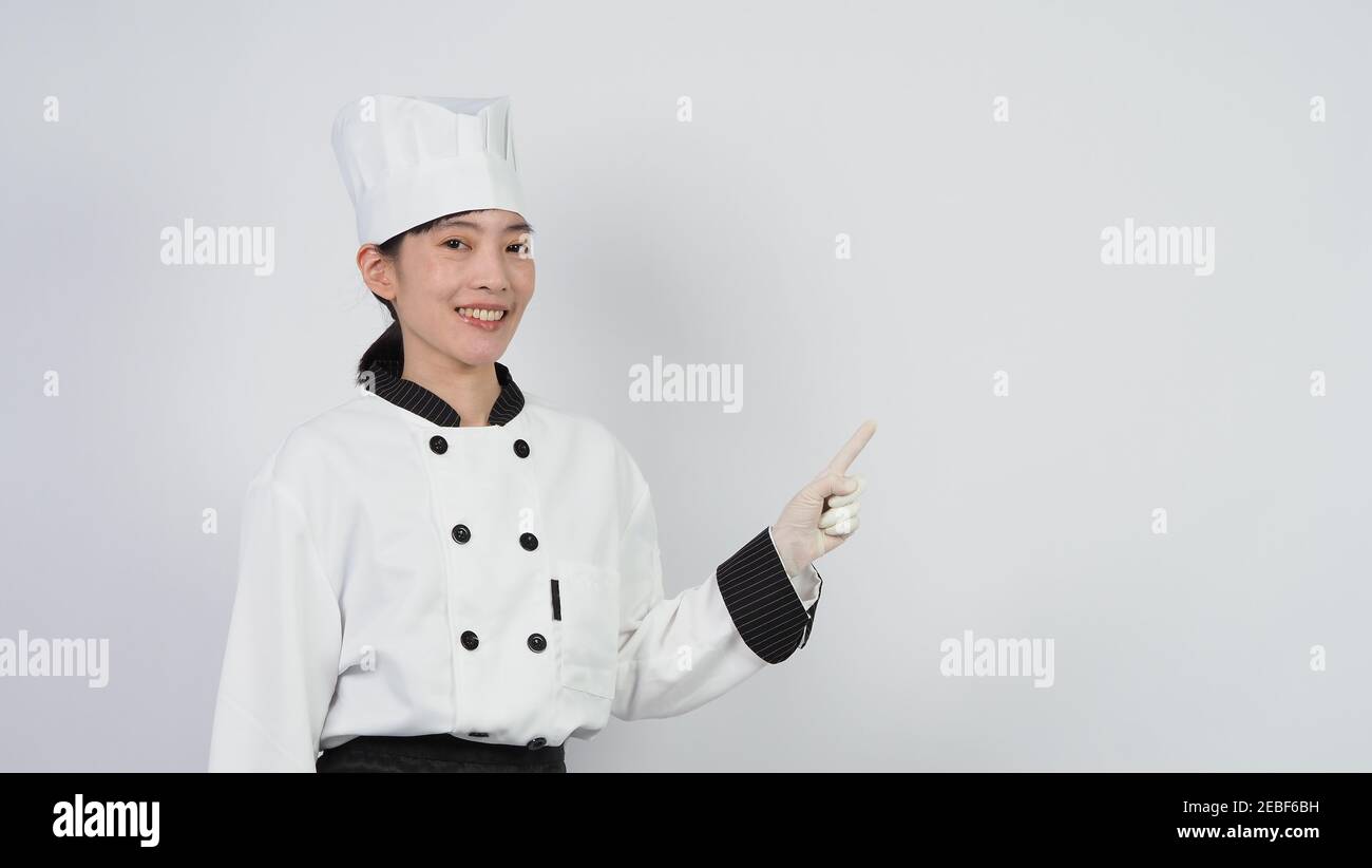 Chef gesturing. Portrait beautiful asian woman cook wearing hat and ...