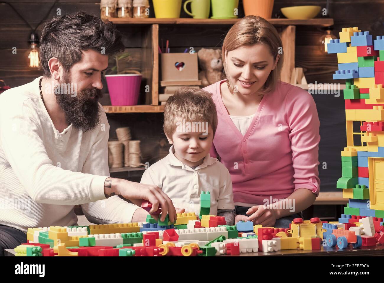 Happy family playing with constructor at home. mother and father ...