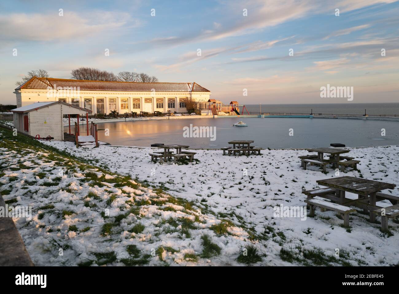 The boating pool building catching the sunset on a winter eveing. There ...