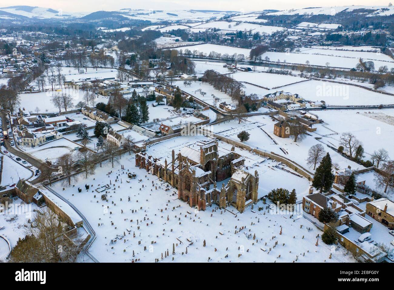 Aerial view of Melrose Abbey under a blanket of snow, Melrose, Scottish ...