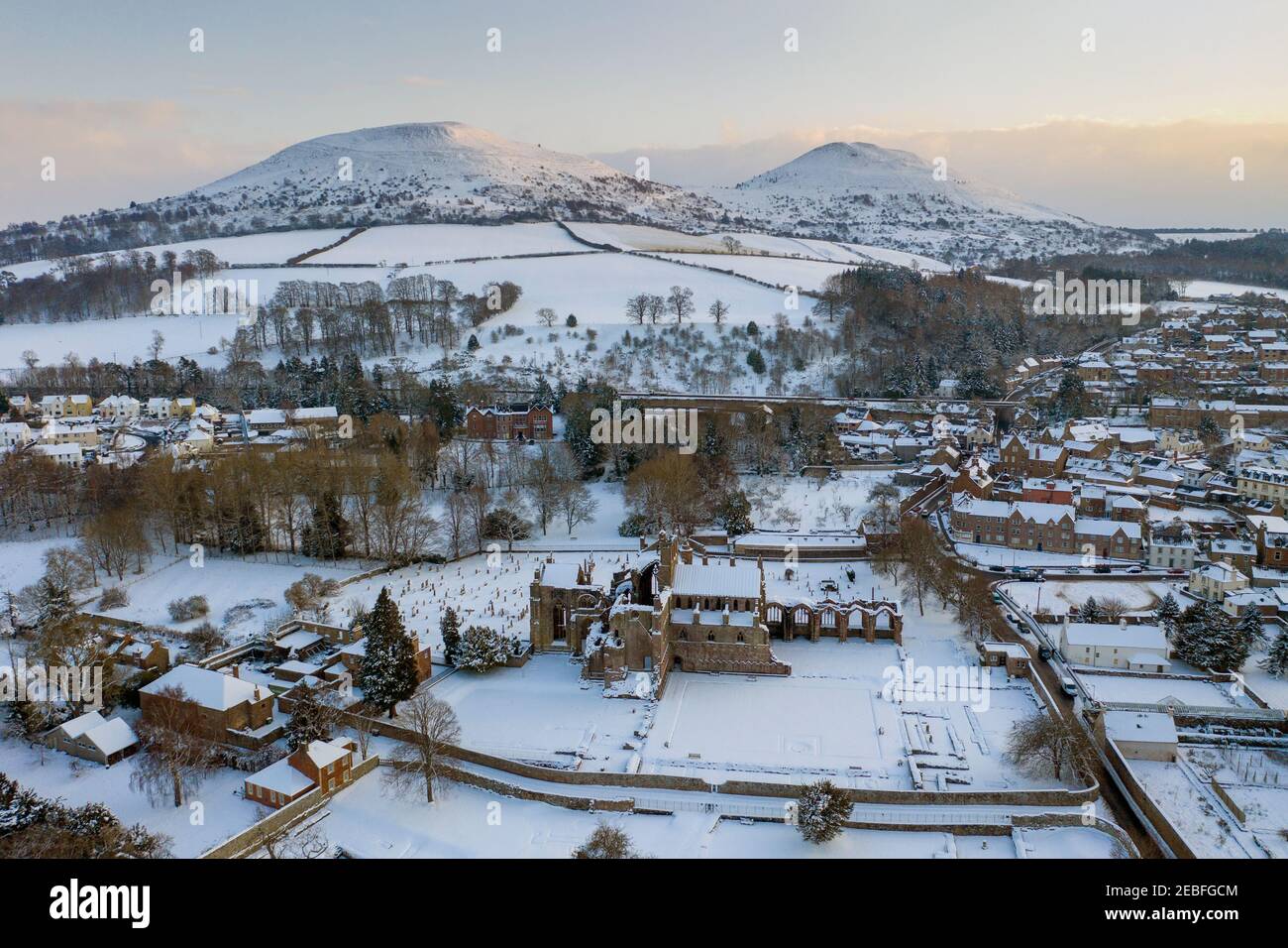 Aerial view of Melrose Abbey under a blanket of snow, Melrose, Scottish ...