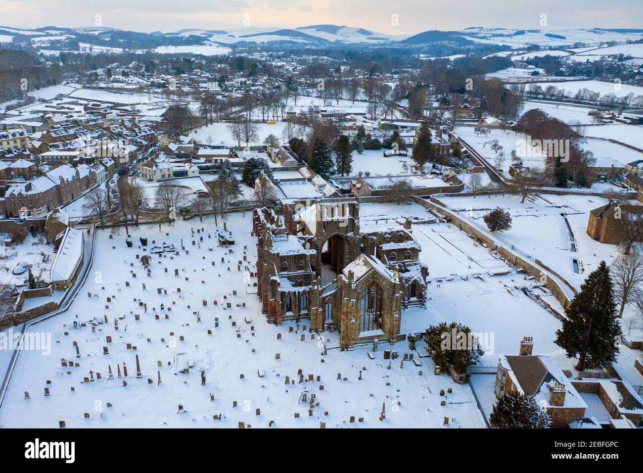 Aerial view of Melrose Abbey under a blanket of snow, Melrose, Scottish ...