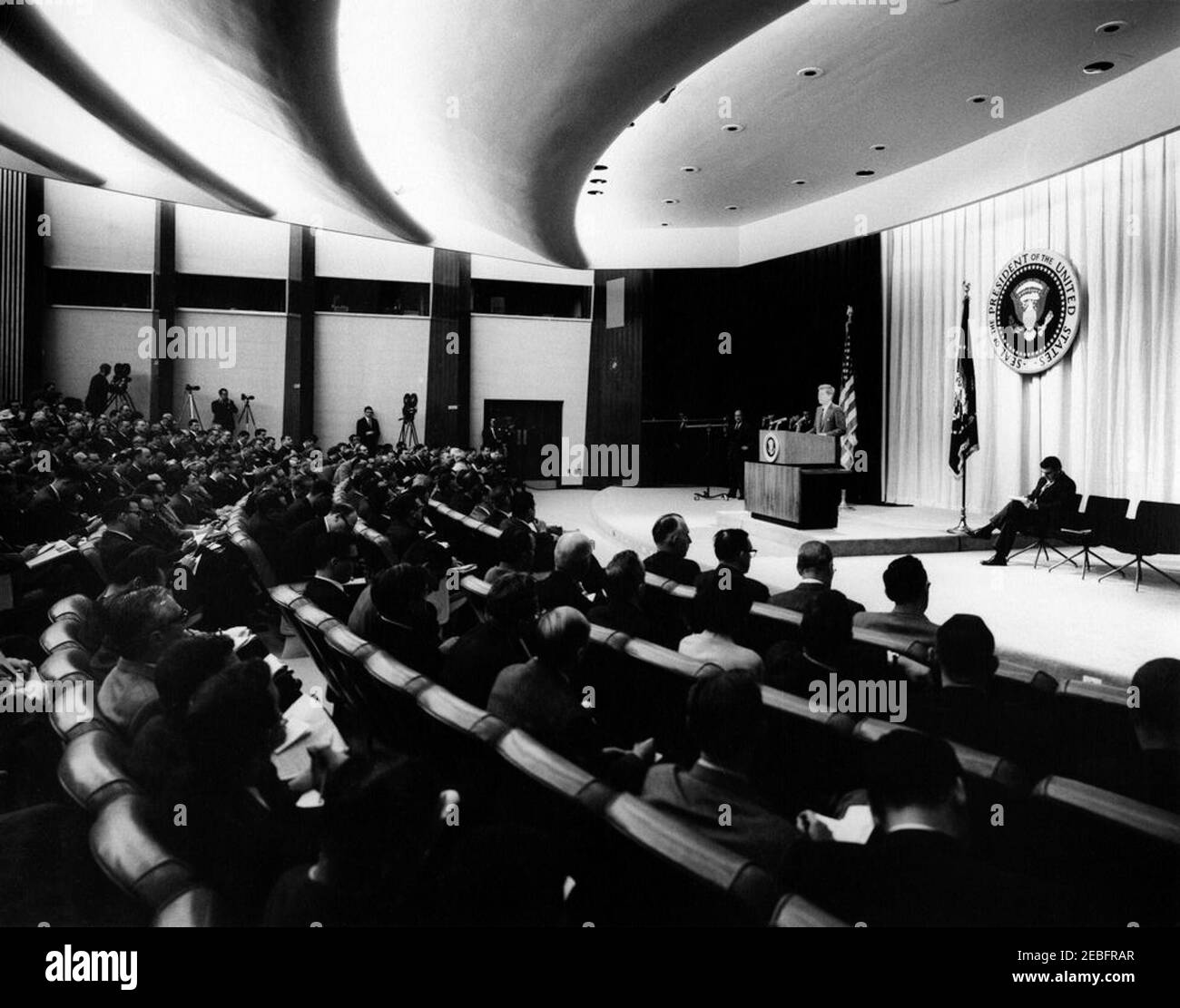Press Conference, State Department Auditorium, 10:00AM. Wide shot from ...
