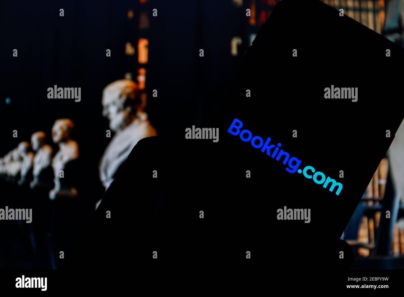 In this photo illustration a Booking.com app logo seen displayed on a ...