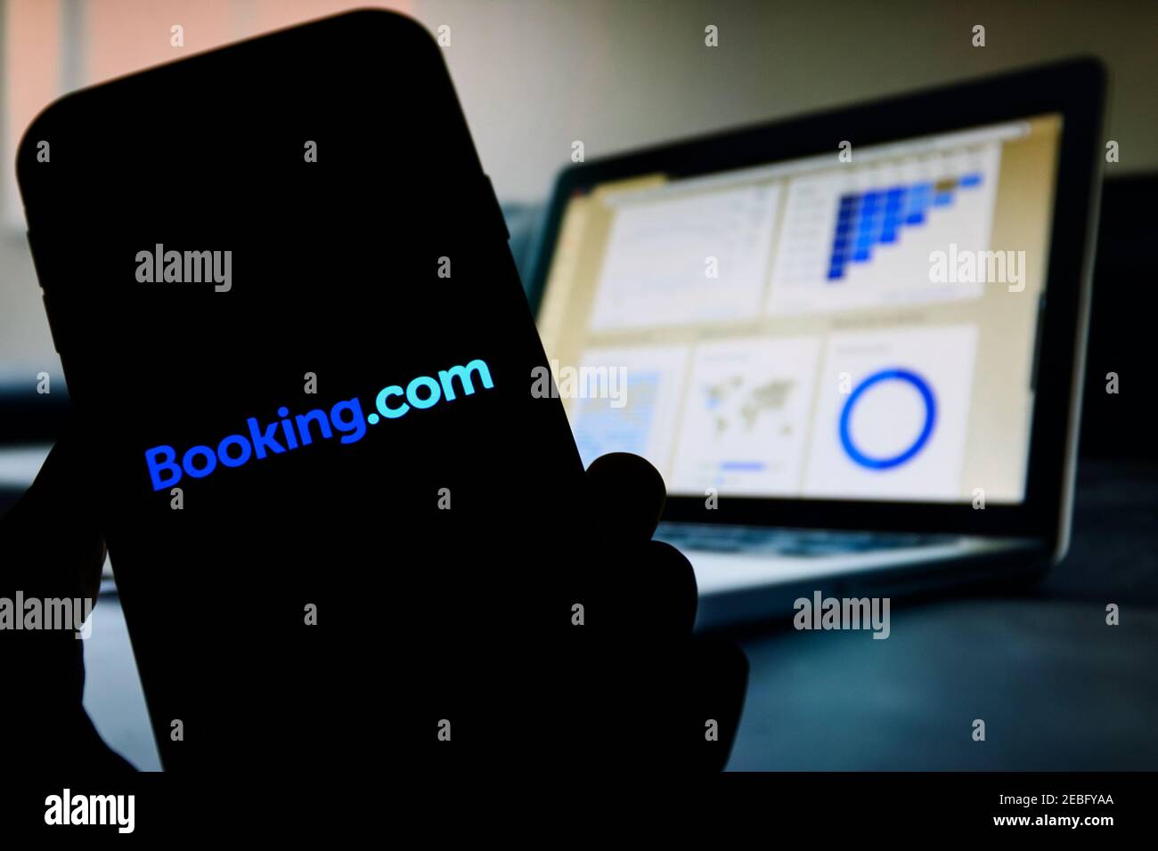 In this photo illustration a Booking.com app logo seen displayed on a ...