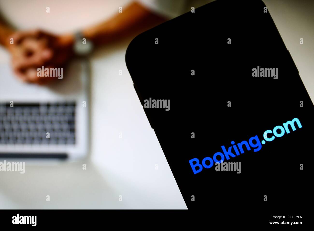 In this photo illustration a Booking.com app logo seen displayed on a ...