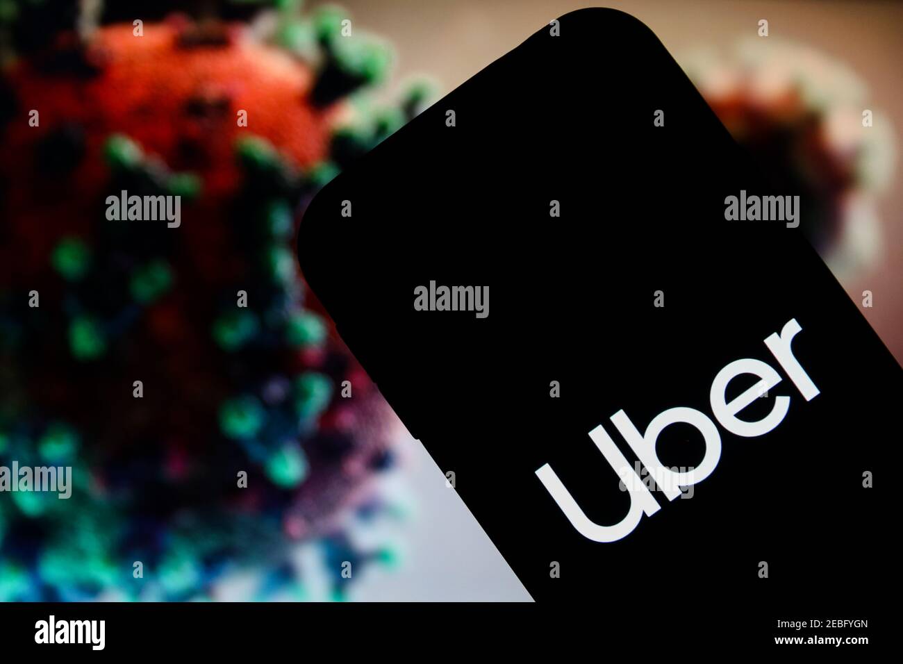 In this photo illustration an Uber company app logo seen displayed on a ...