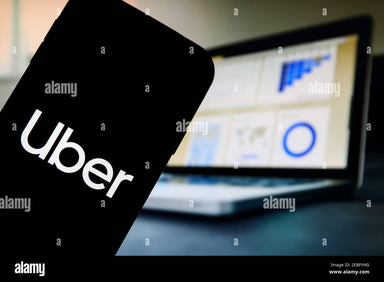 In this photo illustration an Uber company app logo seen displayed on a ...