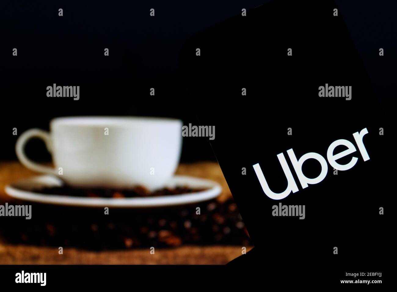 In this photo illustration an Uber company app logo seen displayed on a ...