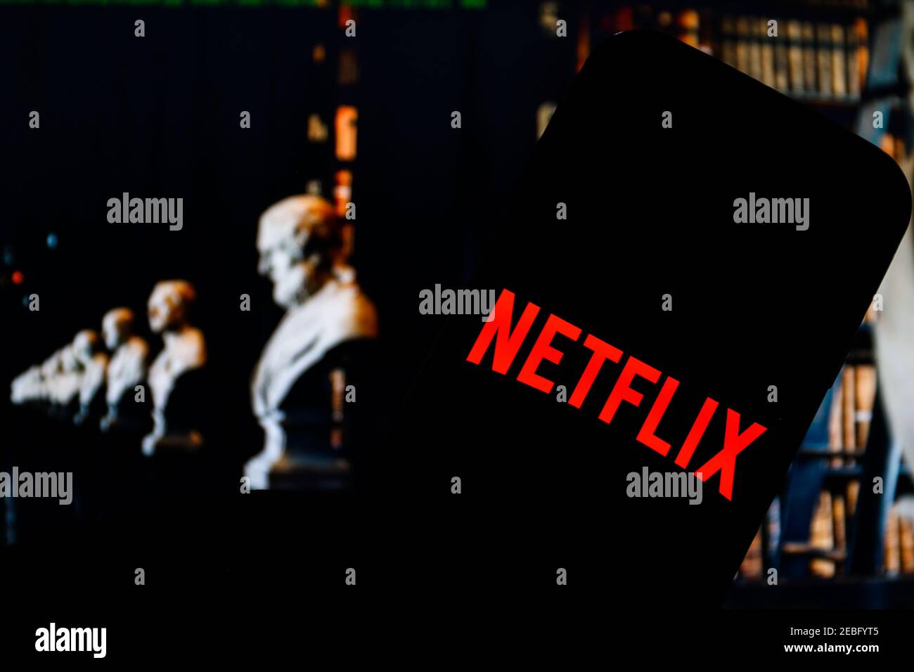 In this photo illustration a Netflix online streaming company app logo ...