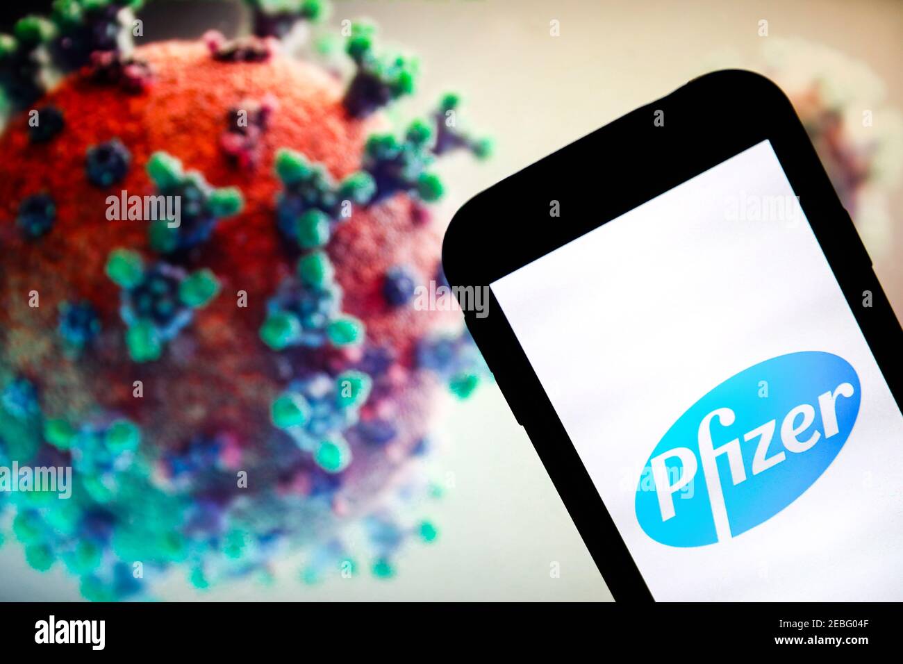 In this photo illustration a Pfizer pharmaceutical company app logo ...