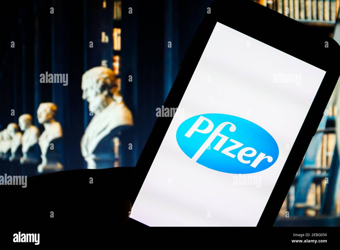 In this photo illustration a Pfizer pharmaceutical company app logo ...