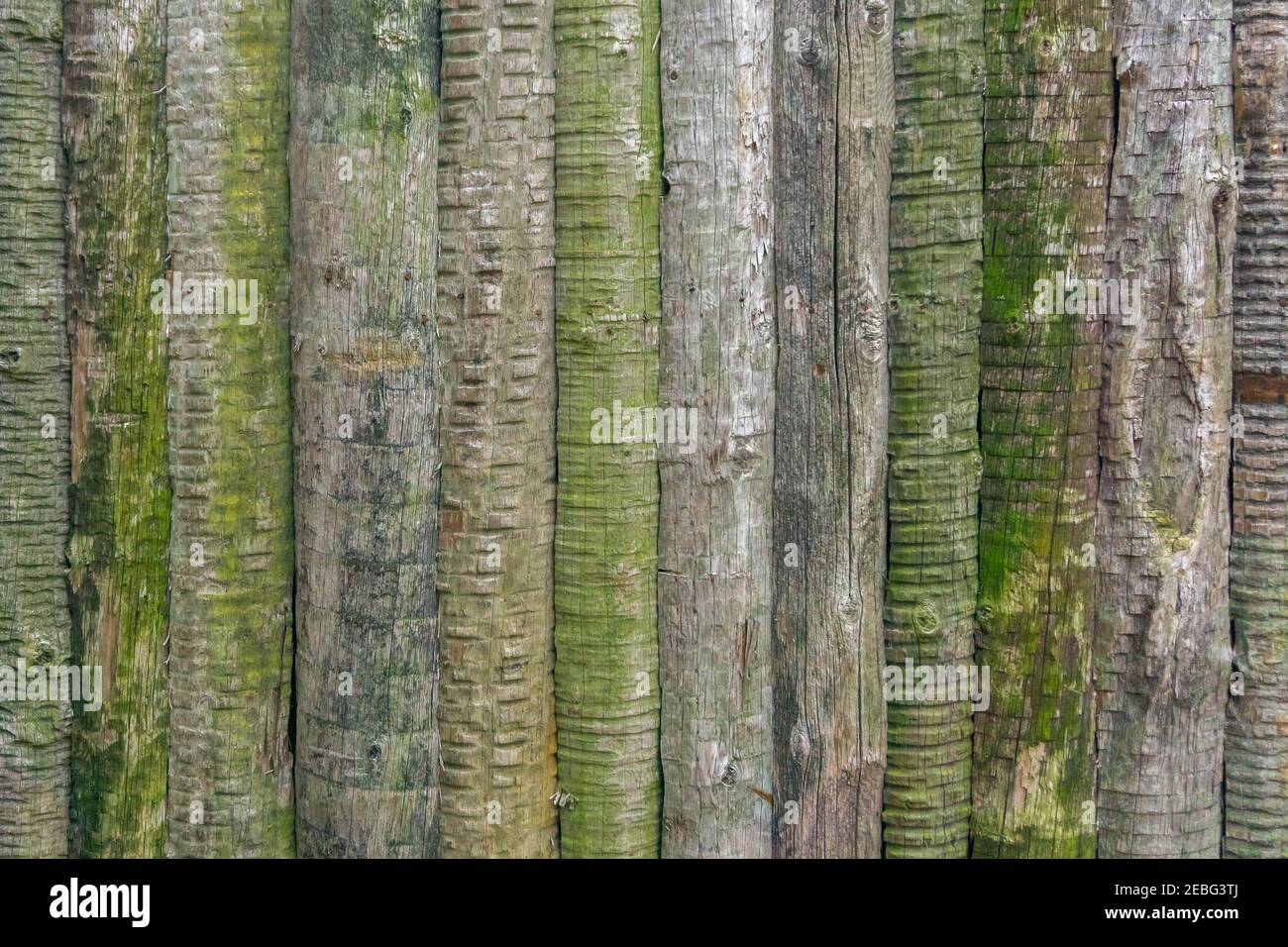 Old homemade traditional fence in countryside. Rustic round wooden ...