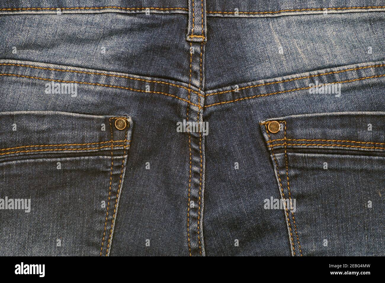 Black jeans fabric (denim). View of the back of the pants Stock Photo ...