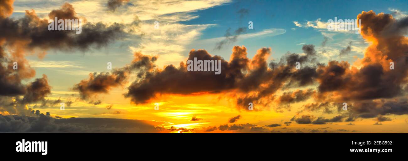 nature background of Summer orange and yellow sky with moving clouds ...