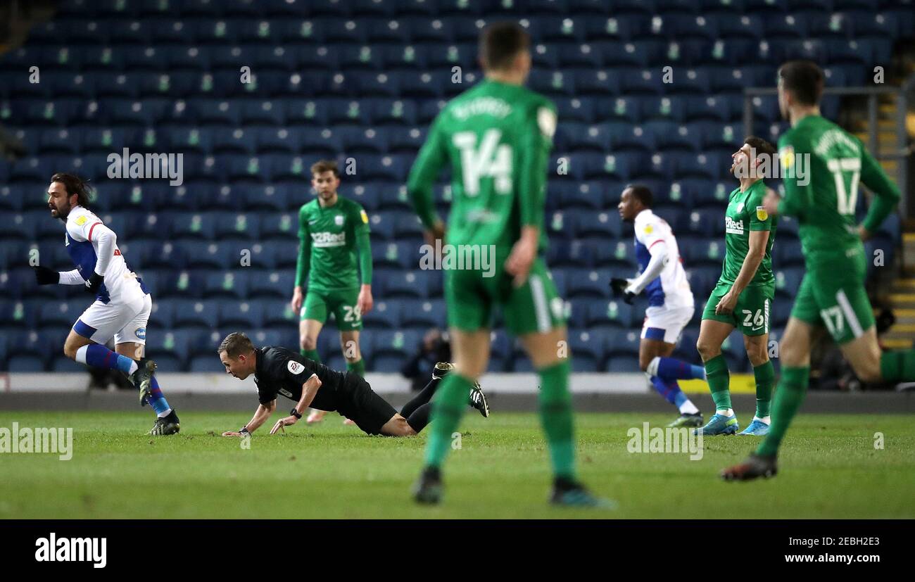 Preston North End's Ched Evans (second right) reacts after colliding ...