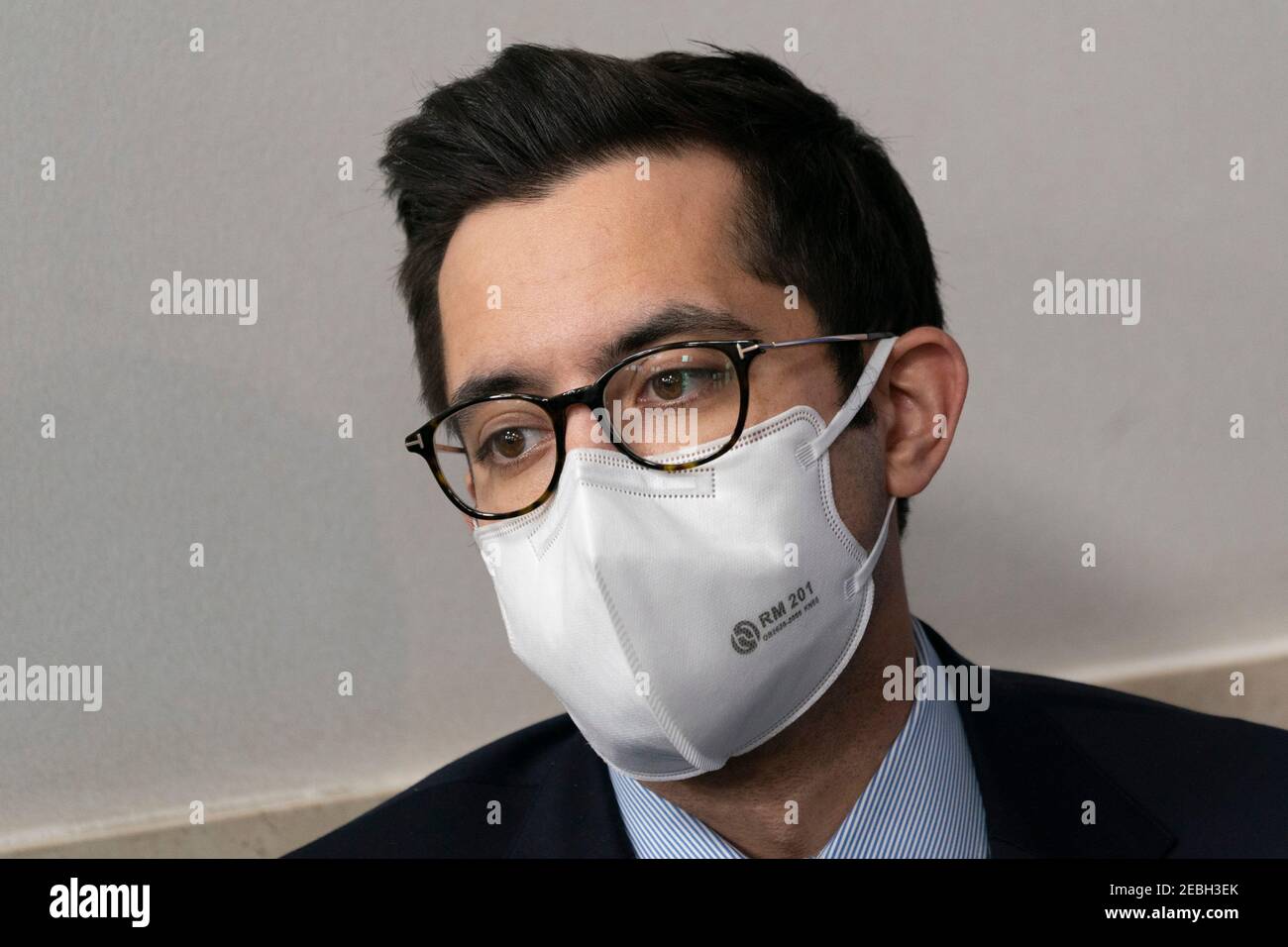 White House duty press secretary TJ Ducklo listens during a briefing ...