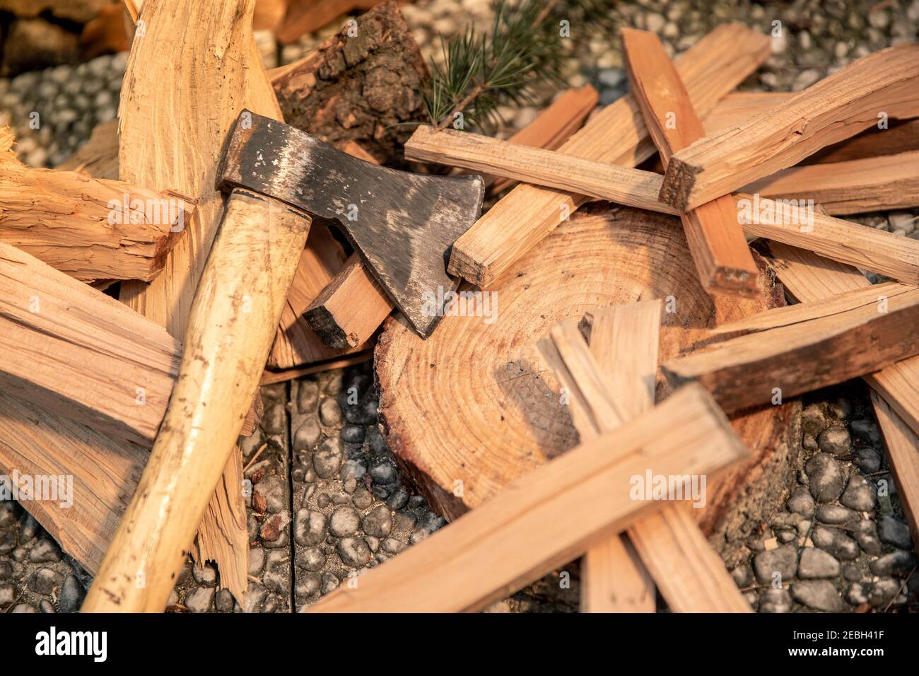 Preparation of wood to light a fire to cook food on grill outdoor ...