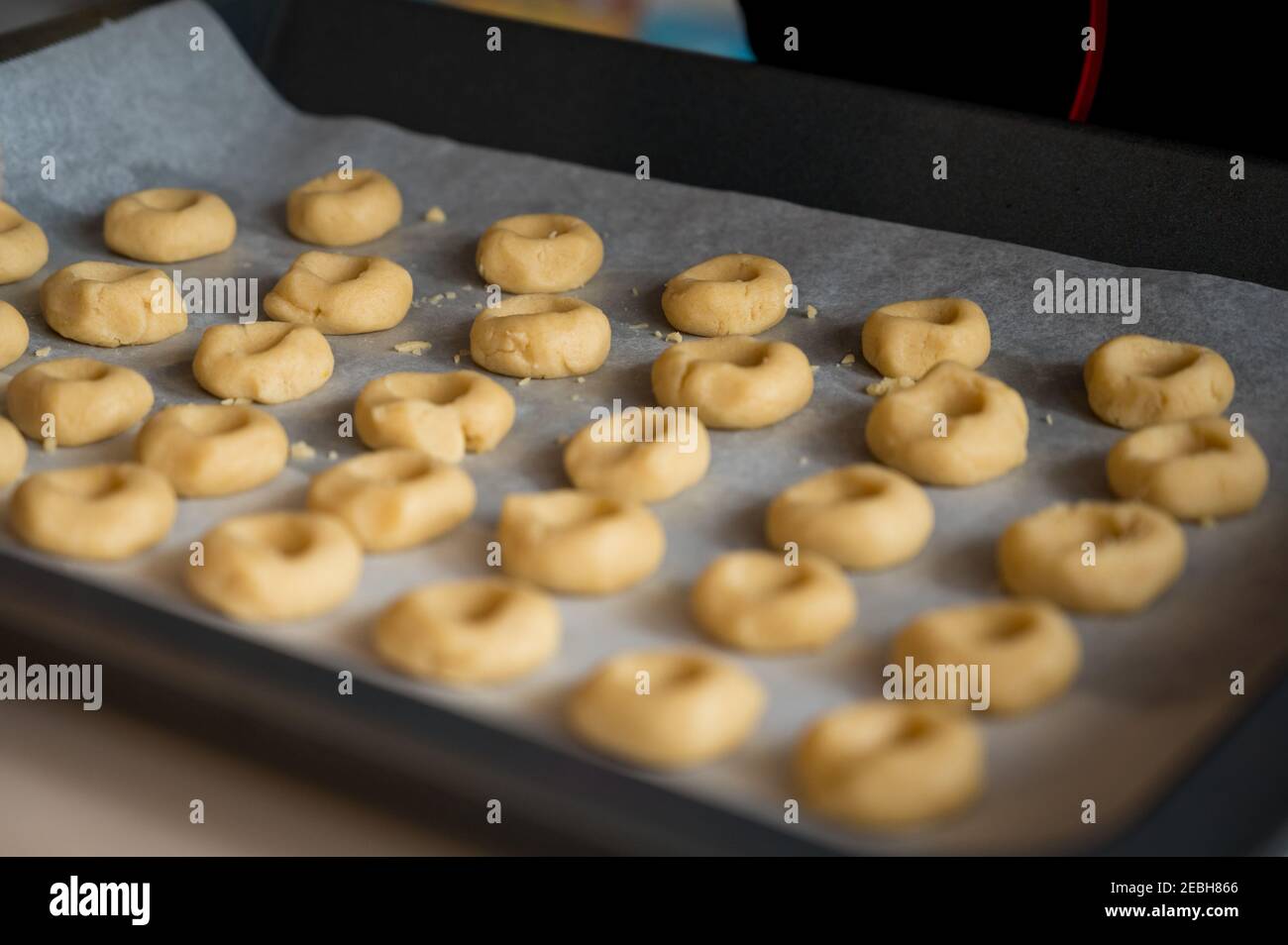 Detail of plate full of home made cookies ready to be baked Stock Photo ...