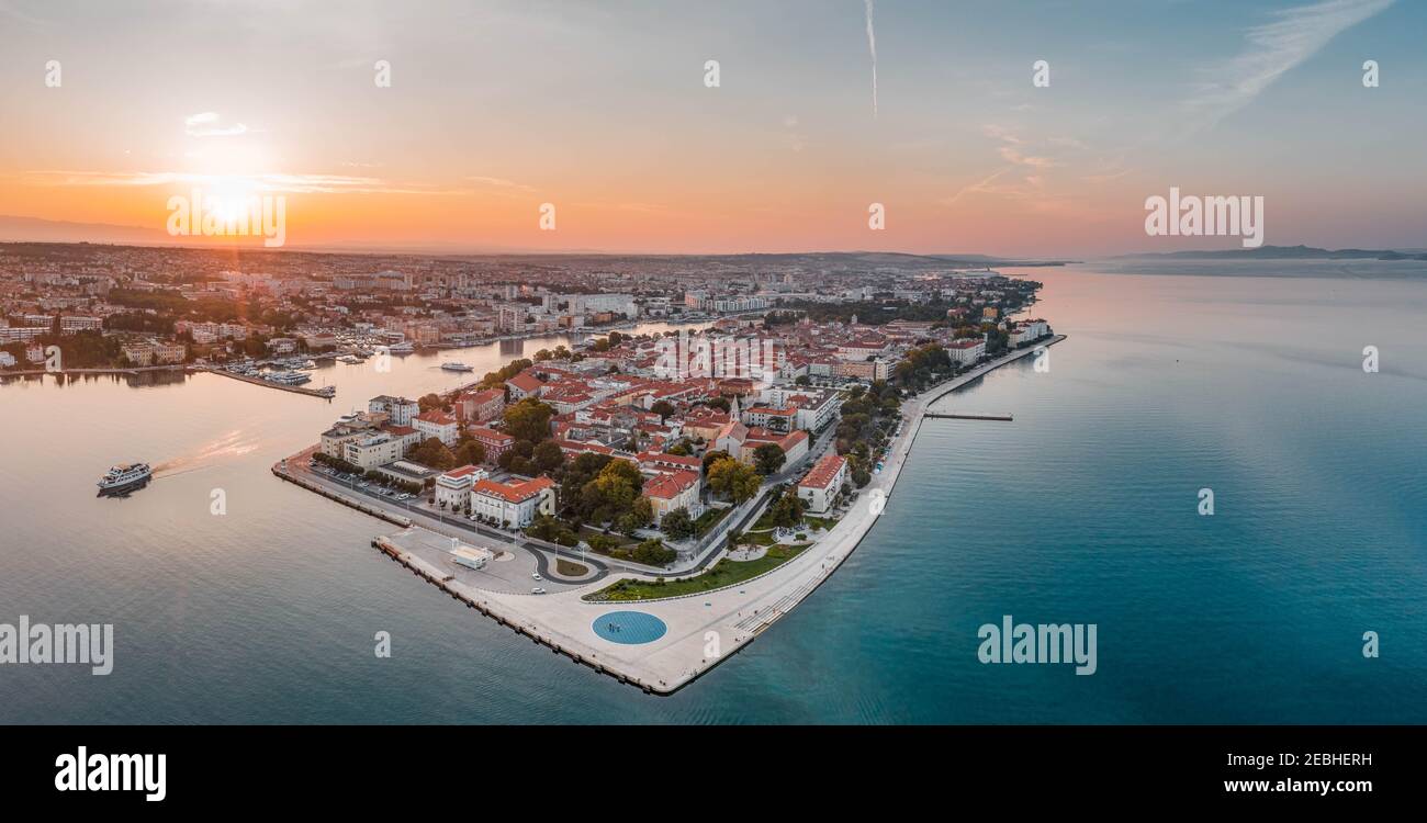 Aerial panoramic drone shot of Zadar old town sea organ in sunrise hour ...