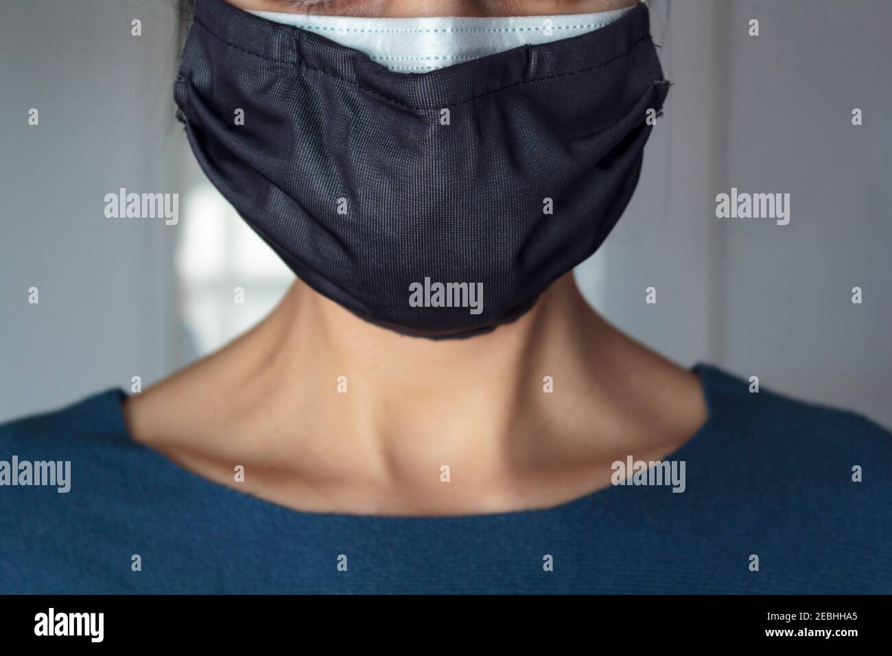 Woman wearing two face masks at the same time Stock Photo - Alamy