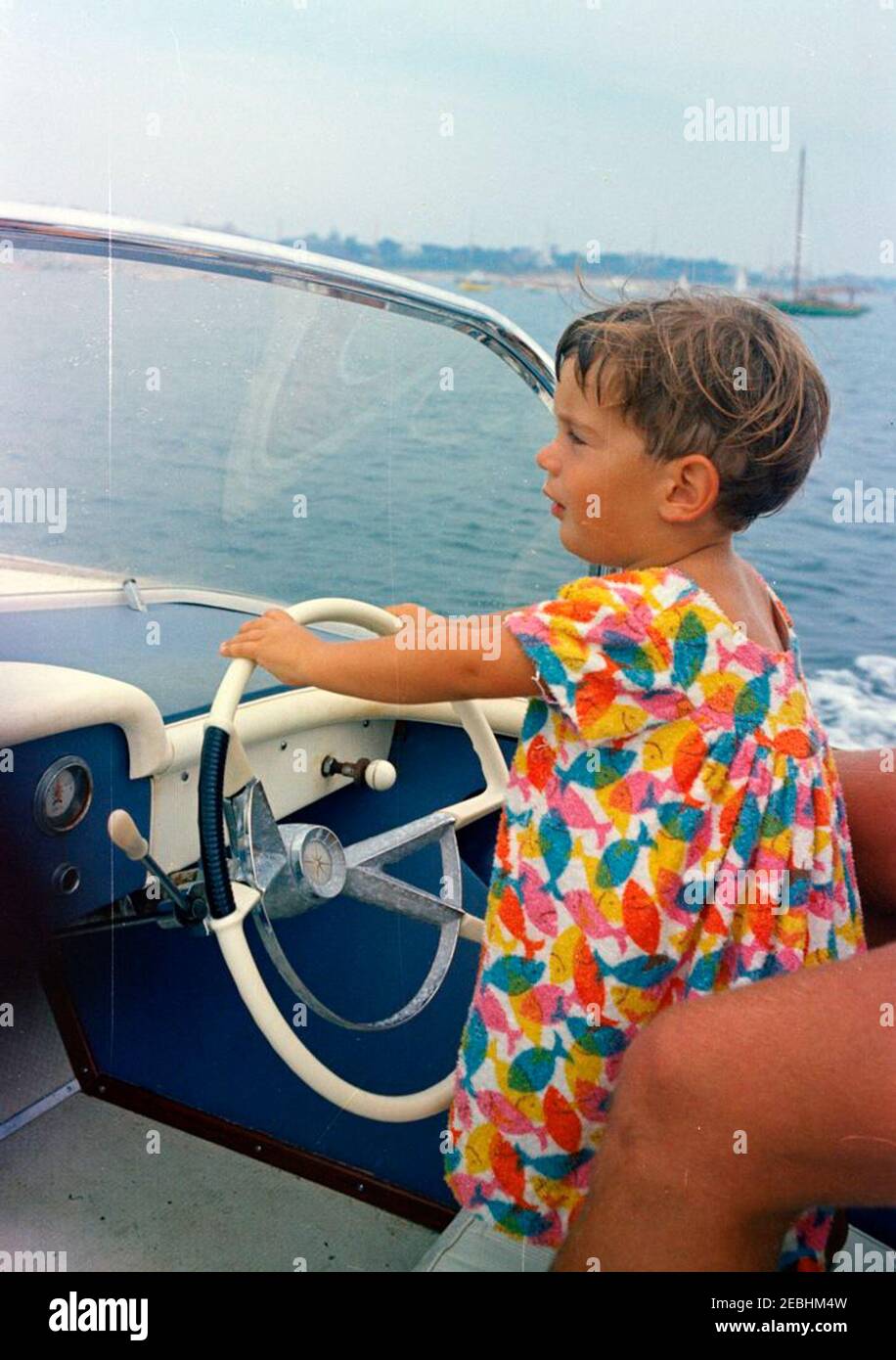 Weekend at Hyannis Port: John F. Kennedy, Jr. (JFK Jr.), at the wheel ...