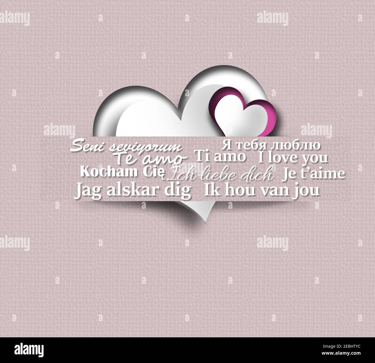 I love you on multiple languages, hearts in paper strip on pastel pink ...