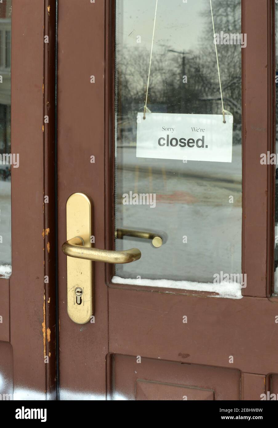 Shop door with sorry we closed sign Stock Photo - Alamy