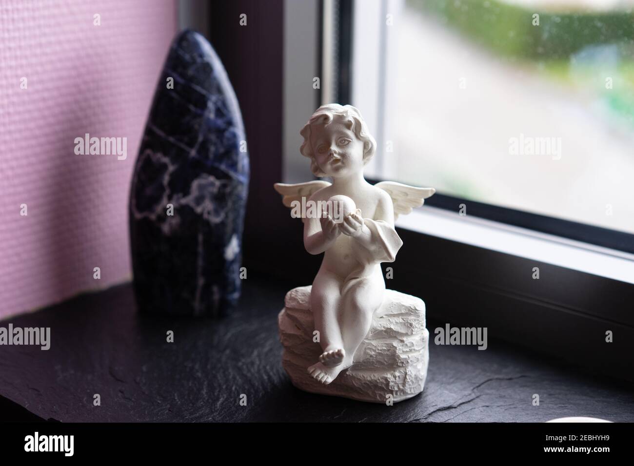 Protective angel in girl's bedroom Stock Photo - Alamy