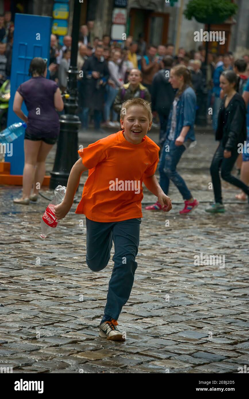 Lviv, Ukraine - May 2, 2016: Celebration pouring water on Monday after ...