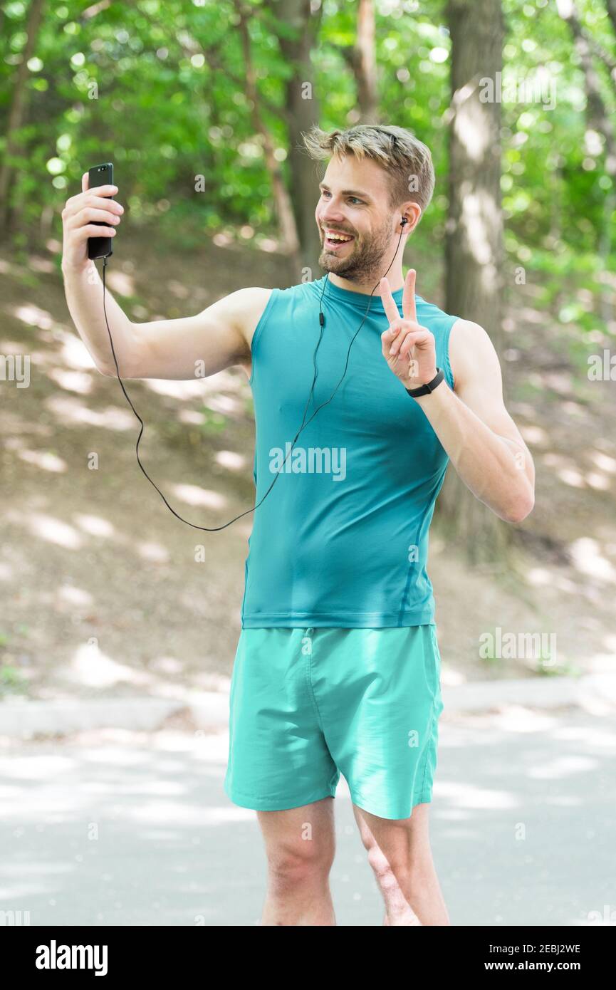healthy life. athletic man in sportswear make selfie. outdoor workout ...