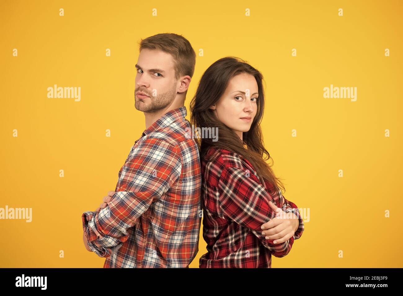 Adult siblings. Sister and brother. Confident team. Back to back ...