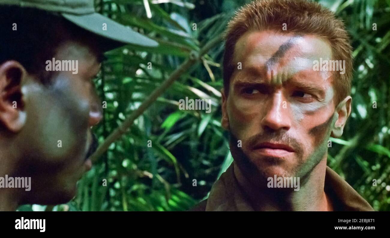 USA.Arnold Schwarzenegger and Carl Weathers in a scene from the (C ...