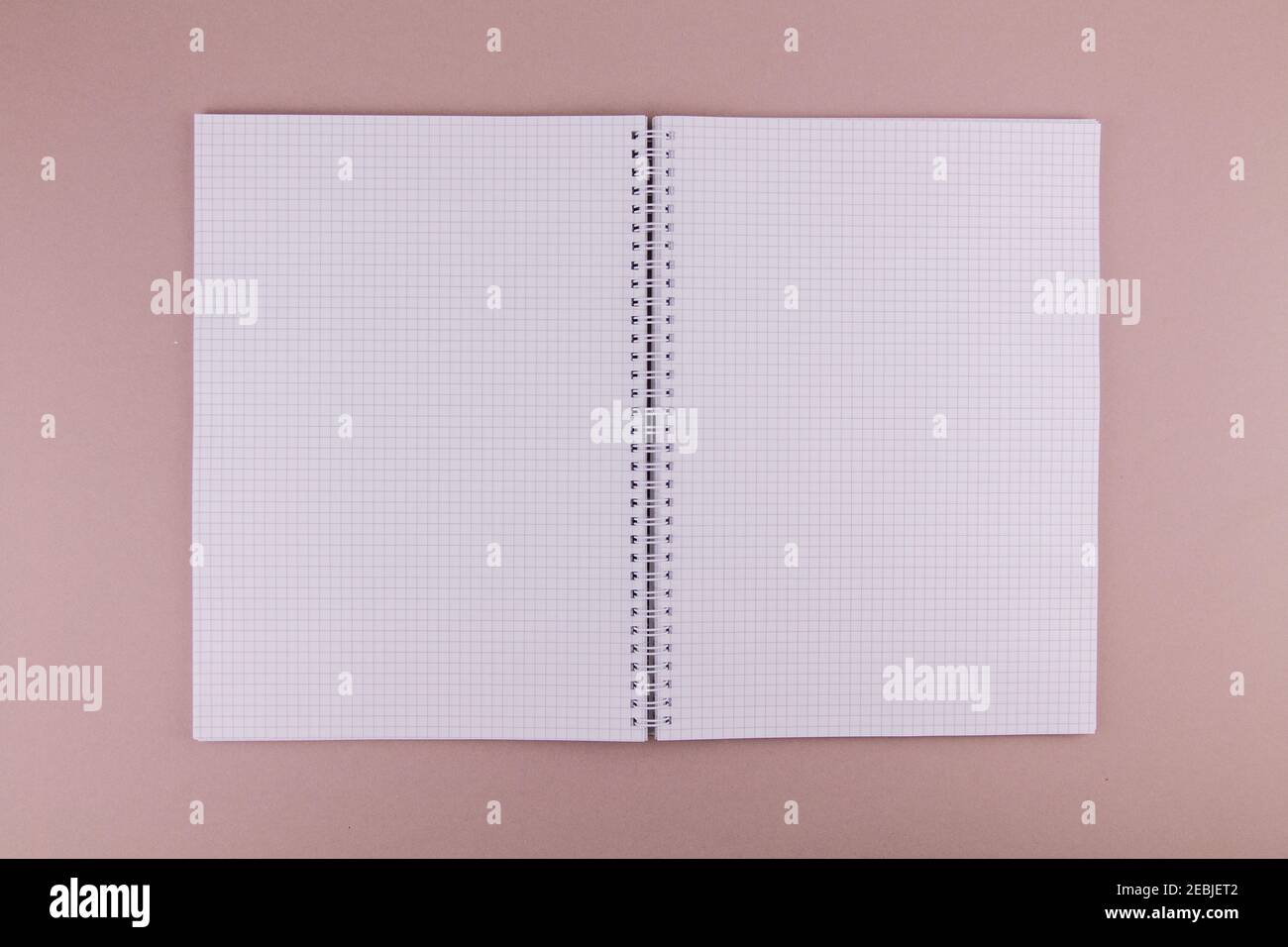 a large a4 notebook on a pink background for study or office work Stock ...